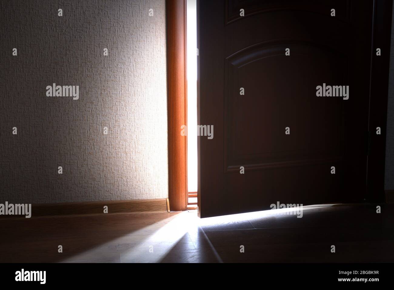 Open door with bright light outside Stock Photo - Alamy