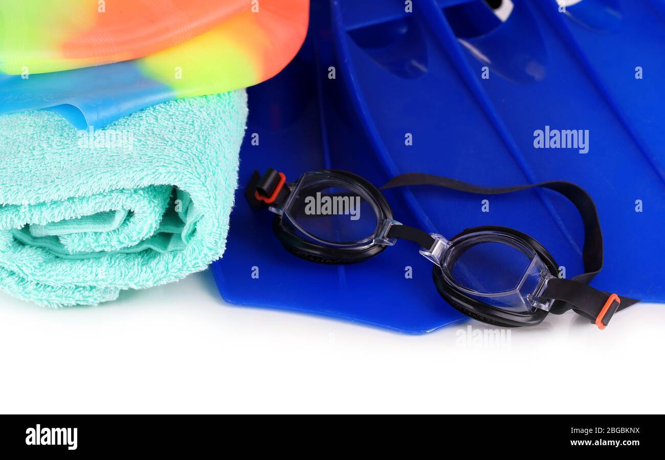Pool cap, goggles, flippers and towel close-up isolated on white Stock ...
