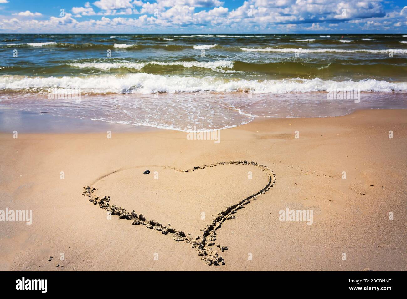heart painted in the sand on the beach Stock Photo - Alamy