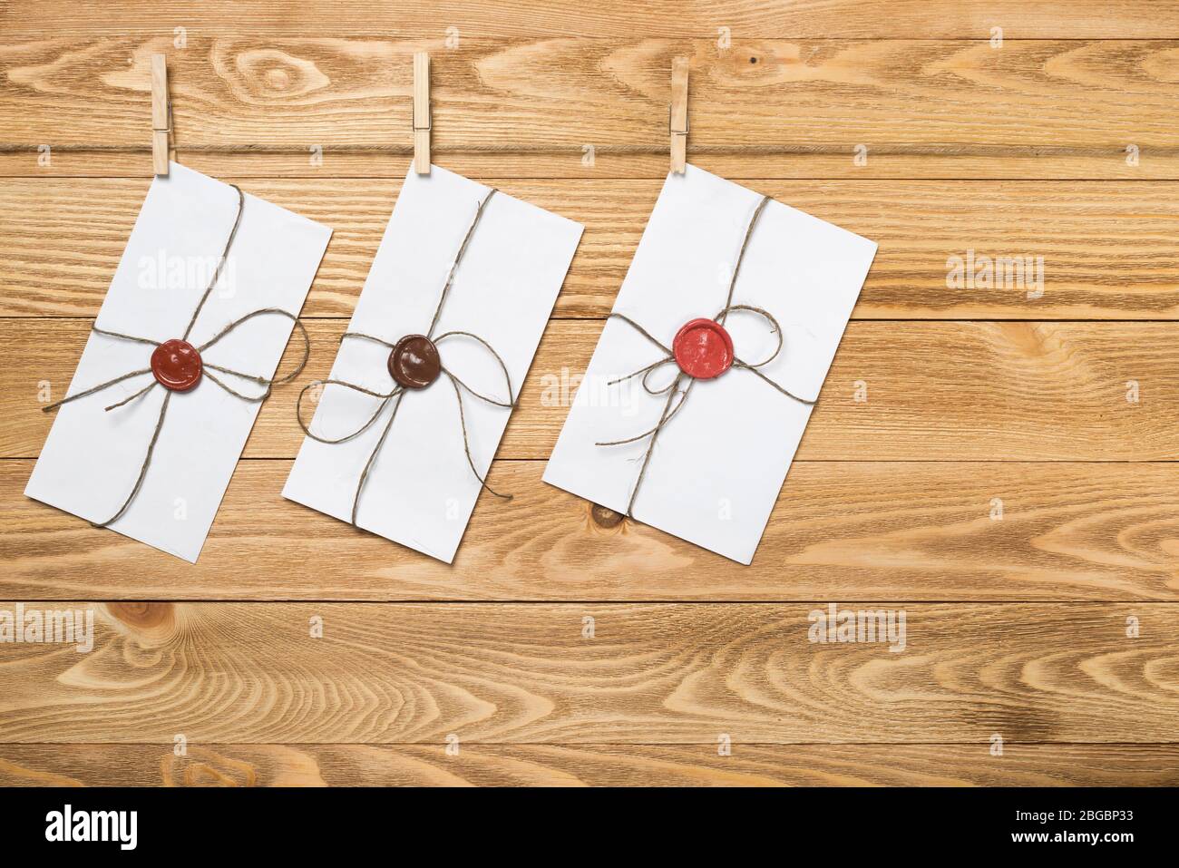 Mail envelope on rope Stock Photo - Alamy