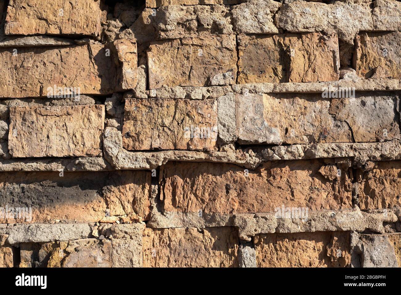 Texture of an old brick wall close up. Red collapsed brick. Background ...