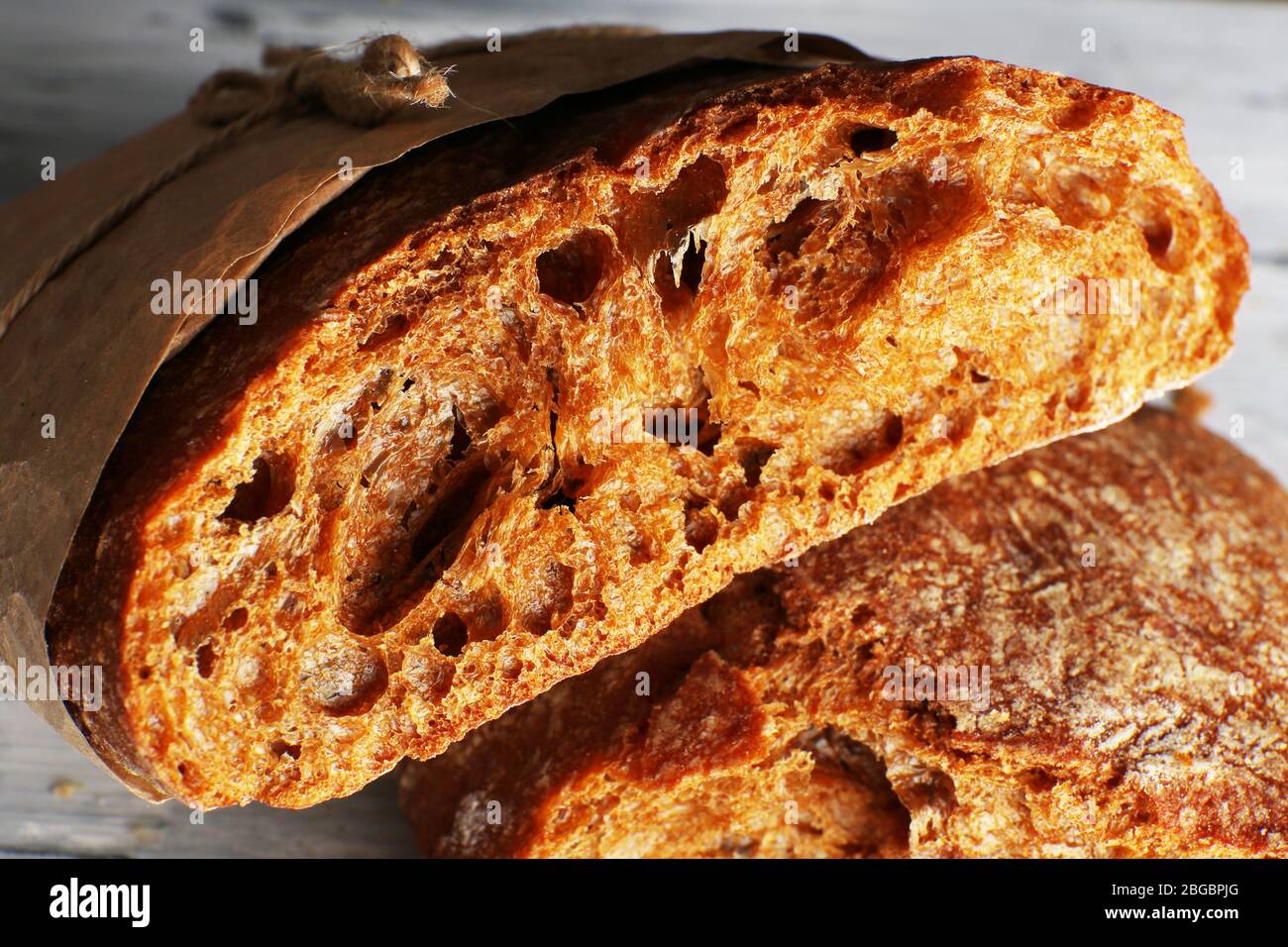 Breaking bread close up Stock Photo - Alamy