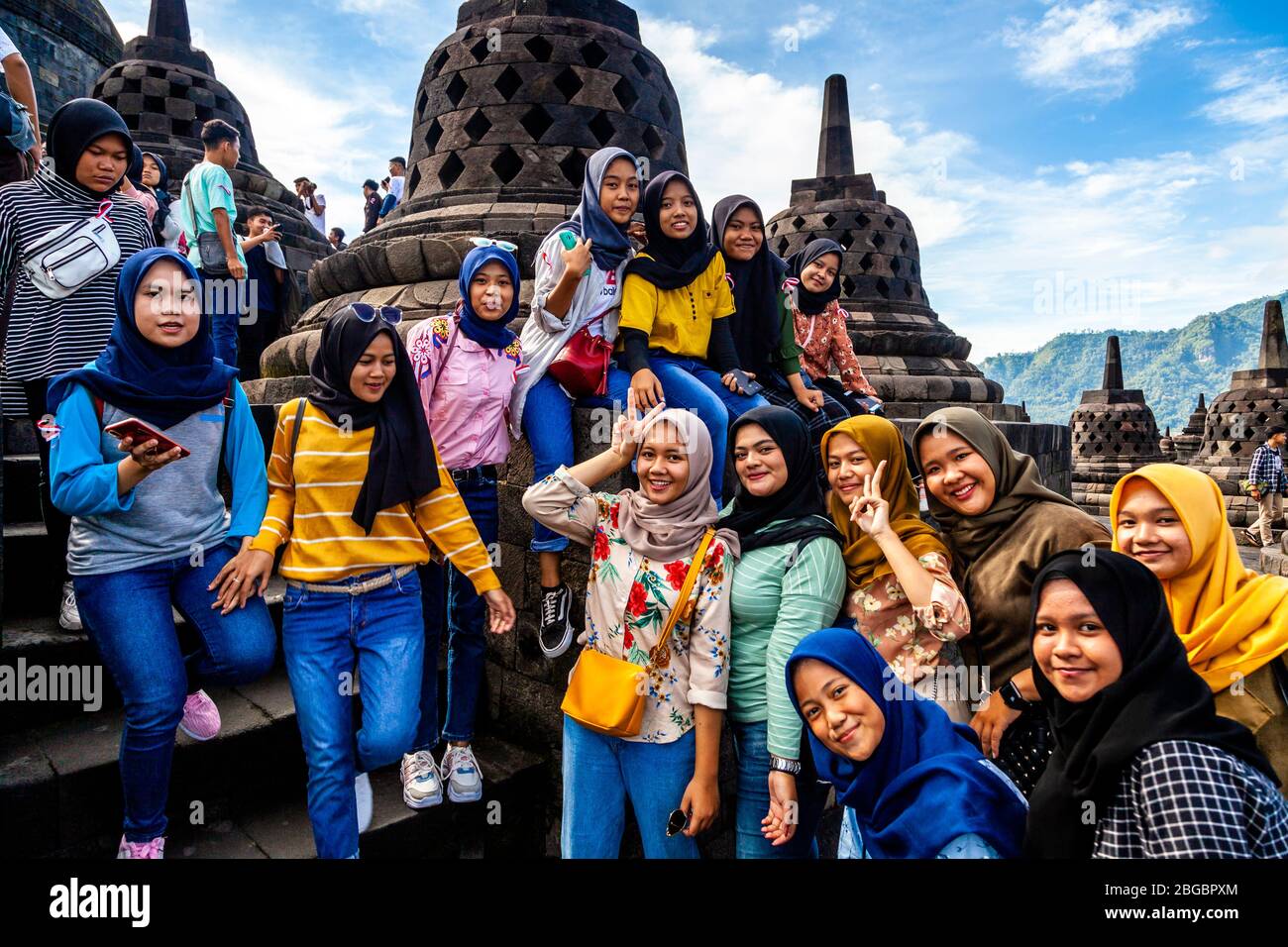 Young Indonesian Female Visitors Pose For A Photo At The Borobudur ...