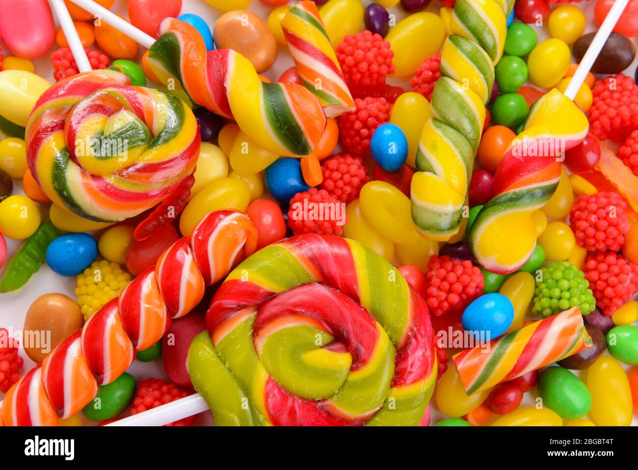 Different colorful fruit candy close-up Stock Photo - Alamy