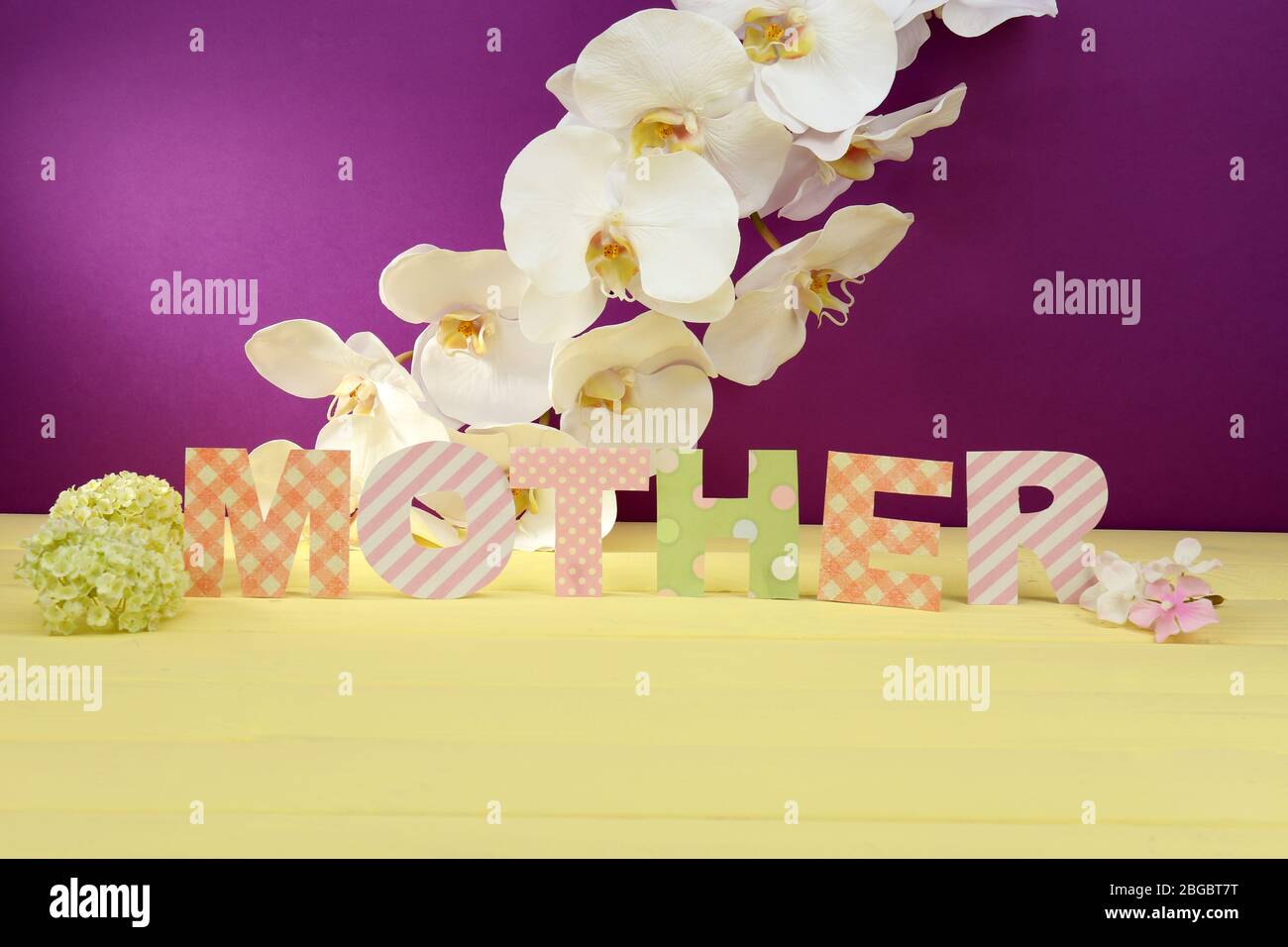 Mother- lettering of handmade paper letters on purple background Stock ...
