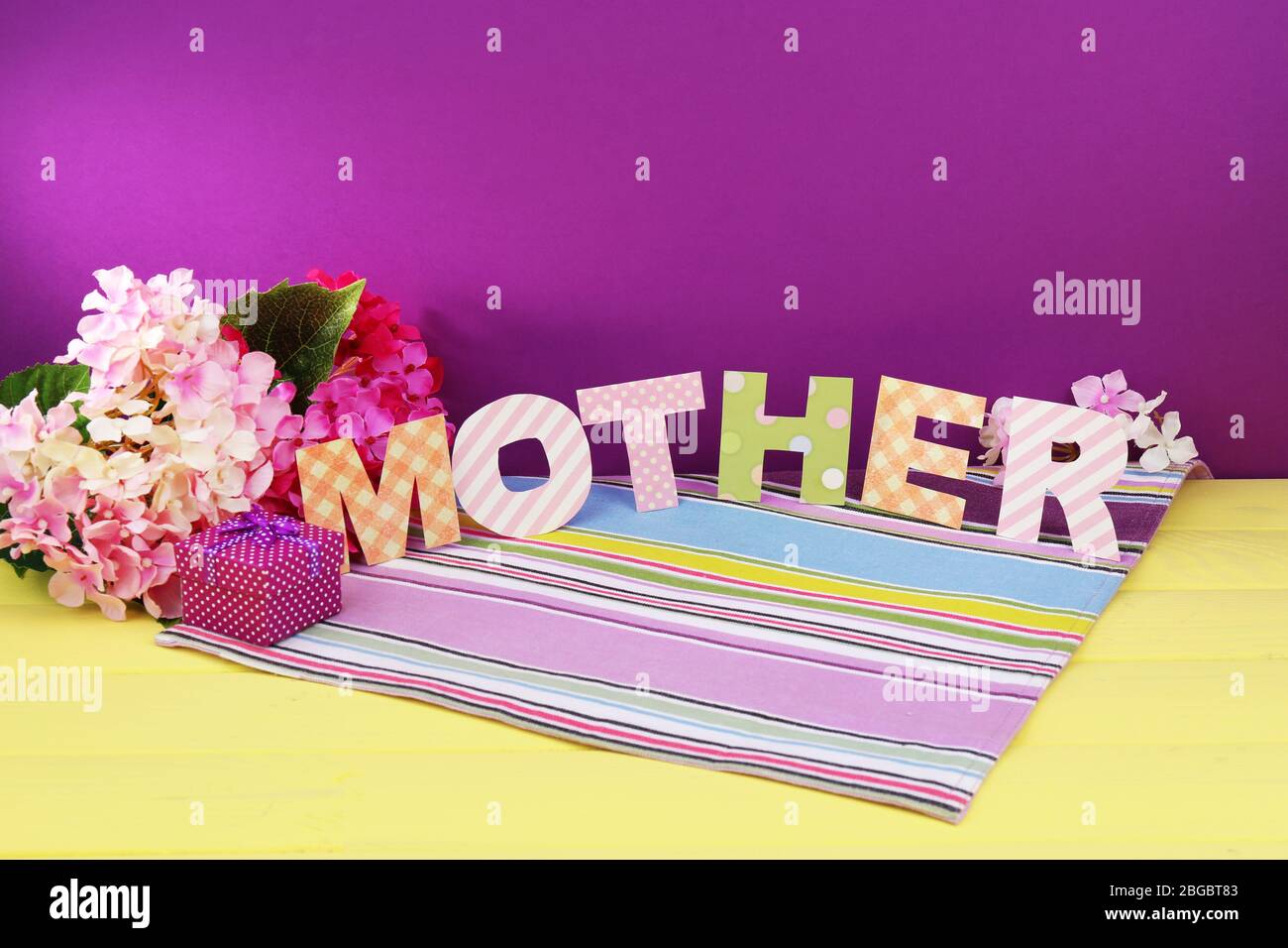 Mother- lettering of handmade paper letters on purple background Stock ...