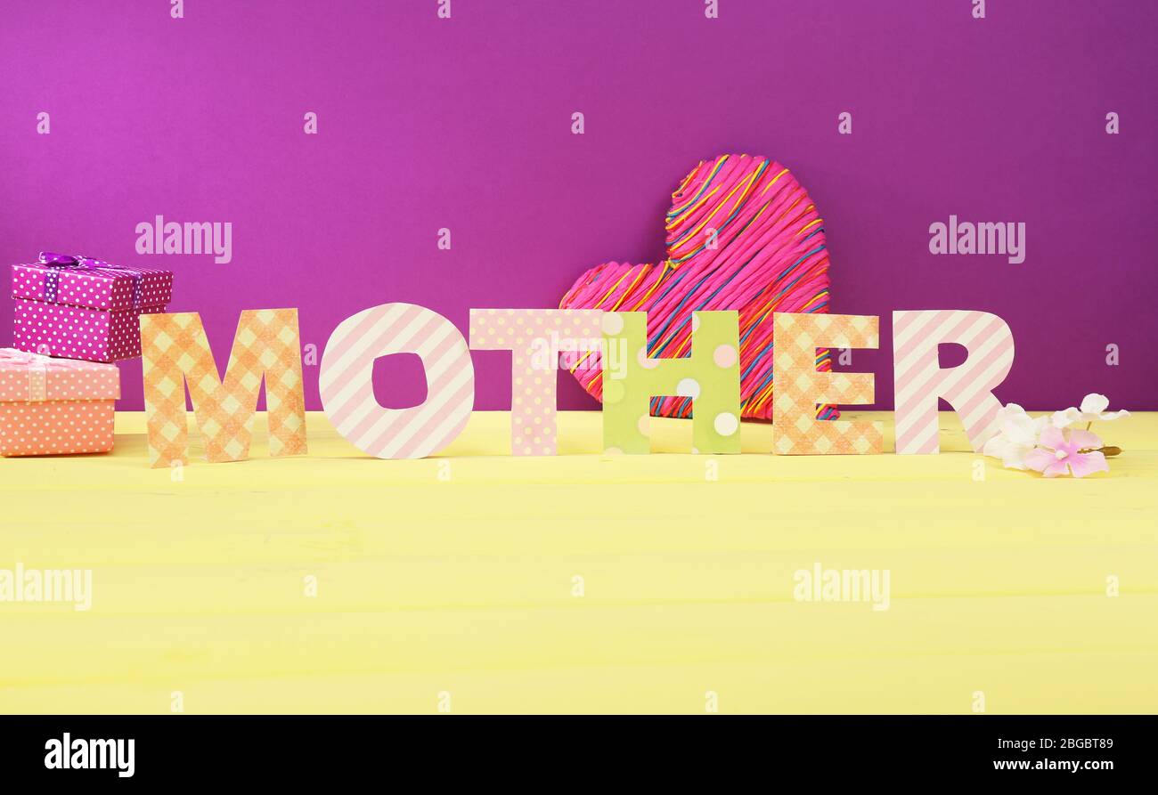 Mother- lettering of handmade paper letters on purple background Stock ...