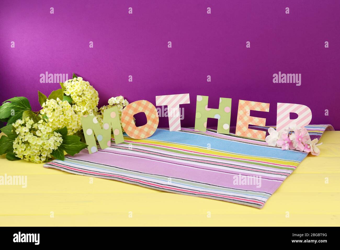 Mother- lettering of handmade paper letters on purple background Stock ...