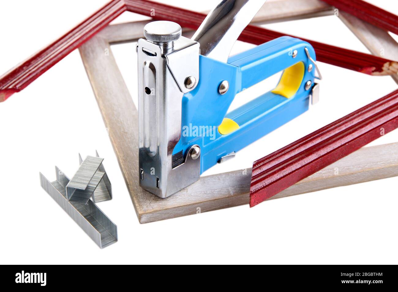 Construction stapler and wooden frames isolated on white Stock Photo ...