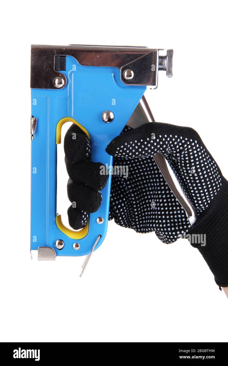 Hand holding construction stapler isolated on white Stock Photo - Alamy