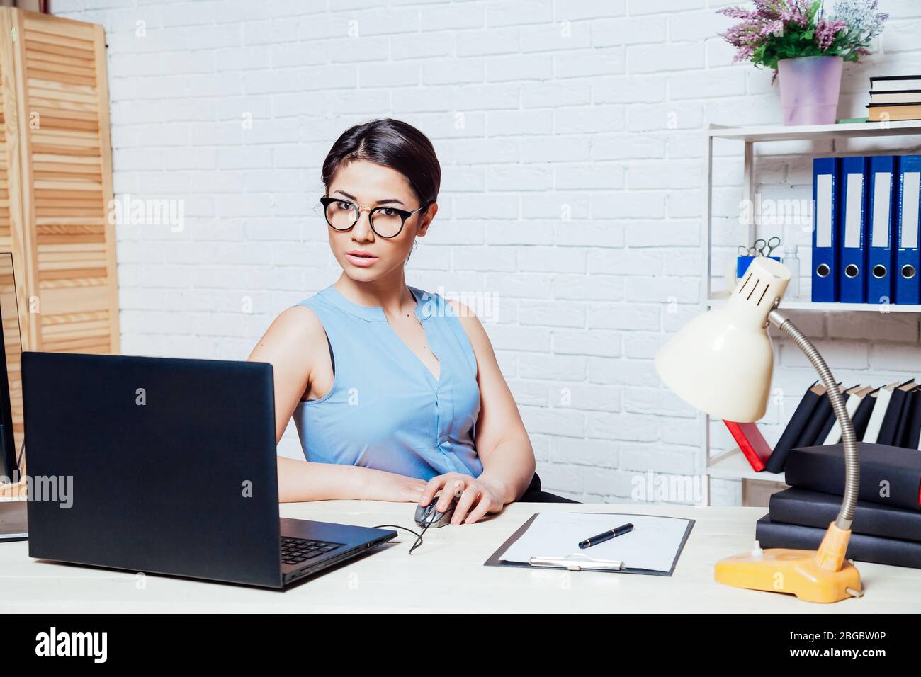 the girl works in an Office at a computer Stock Photo - Alamy