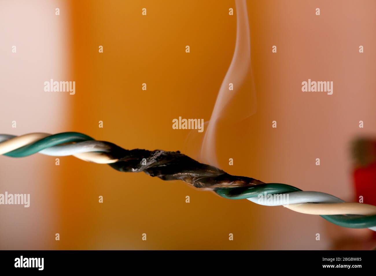 Short circuit, burnt cable, on dark color background Stock Photo - Alamy