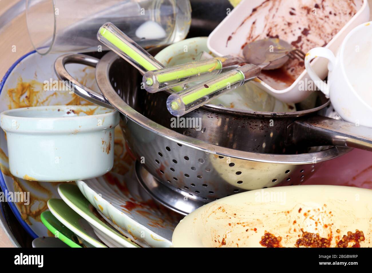 Kitchen utensils need wash close up Stock Photo - Alamy