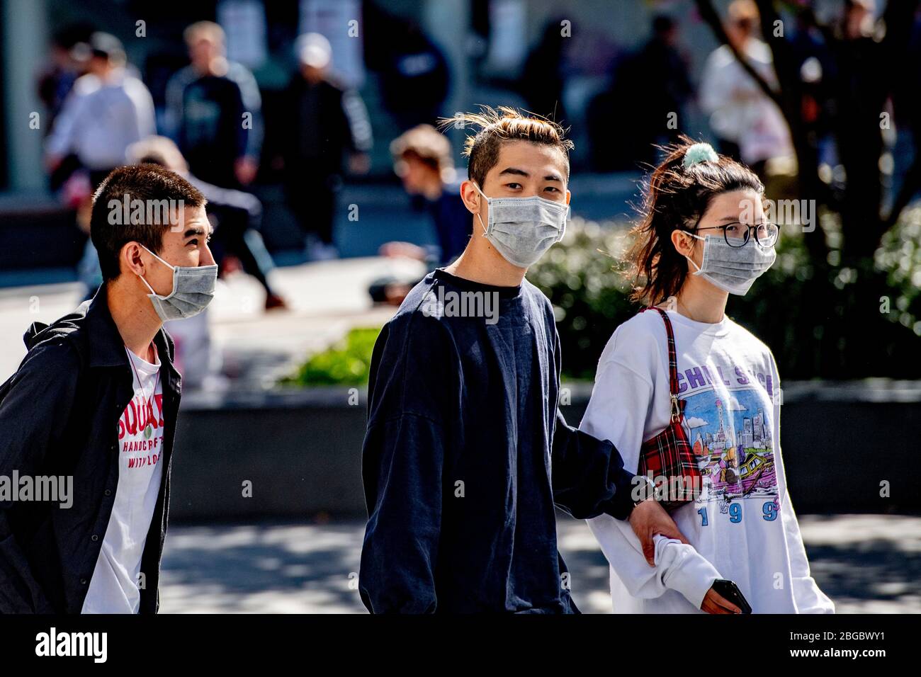People wearing face masks as a preventive measure against the spread of ...