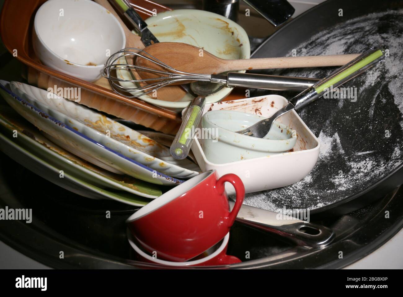 Kitchen utensils need wash close up Stock Photo - Alamy