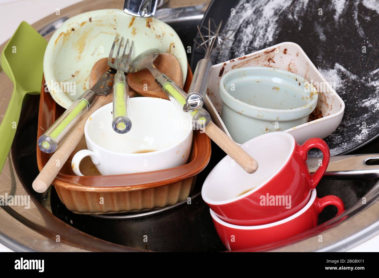 Kitchen utensils need wash close up Stock Photo - Alamy