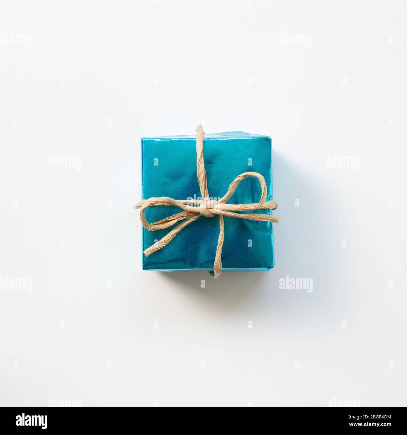 Blue shiny metallic gift box isolated on white background. top view ...