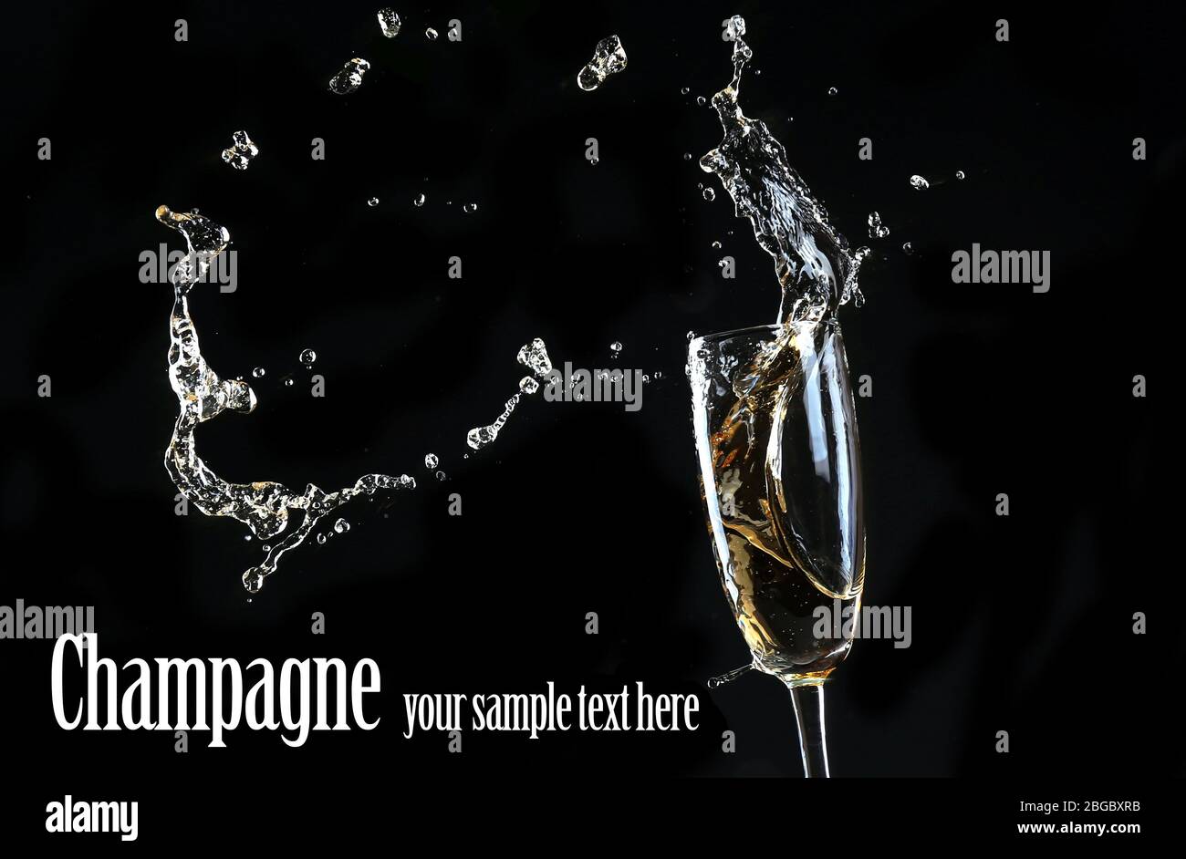Glass of champagne with splash, on black background Stock Photo - Alamy