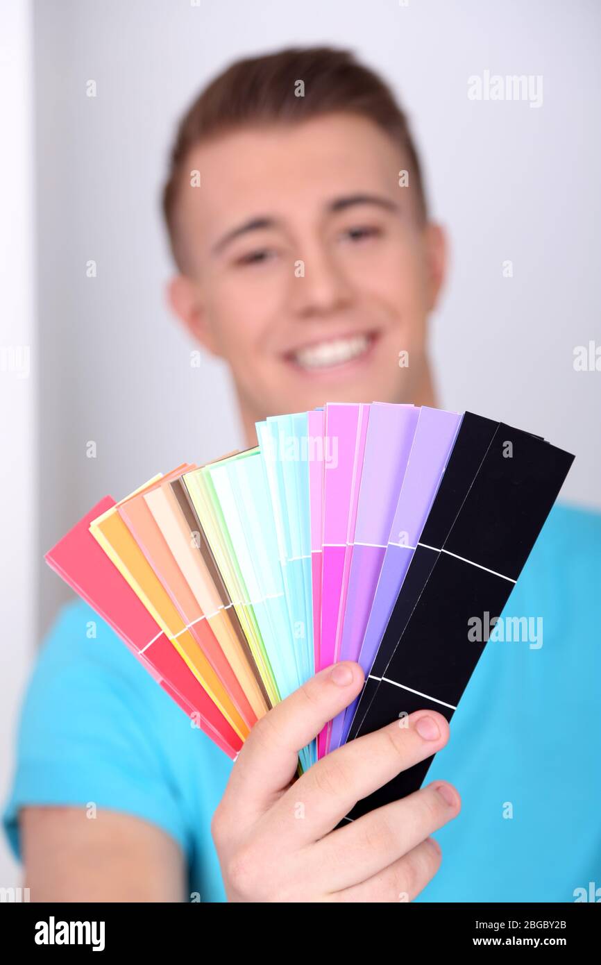 Young man holding palette hi-res stock photography and images - Alamy