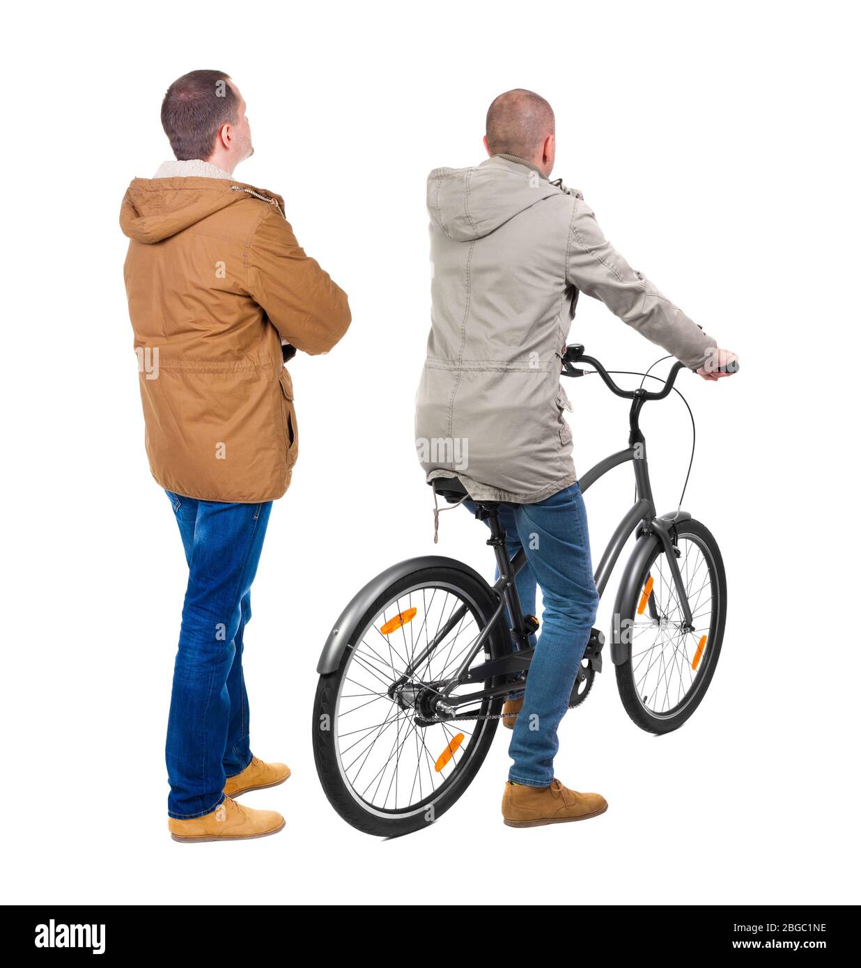 Back view of two man on a bicycle in winter jacket. Rear view people ...