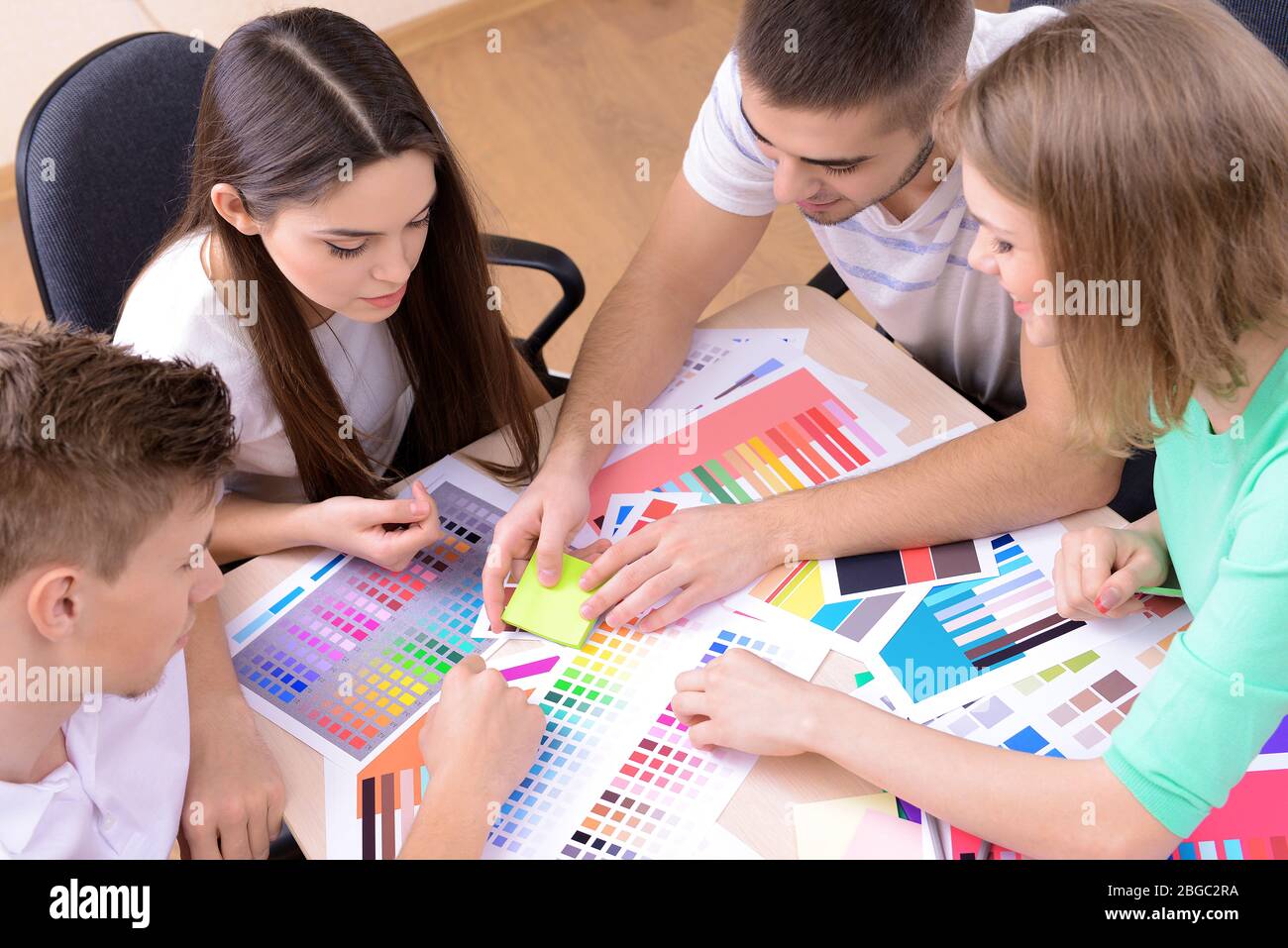 Business team working on their project together at office Stock Photo ...