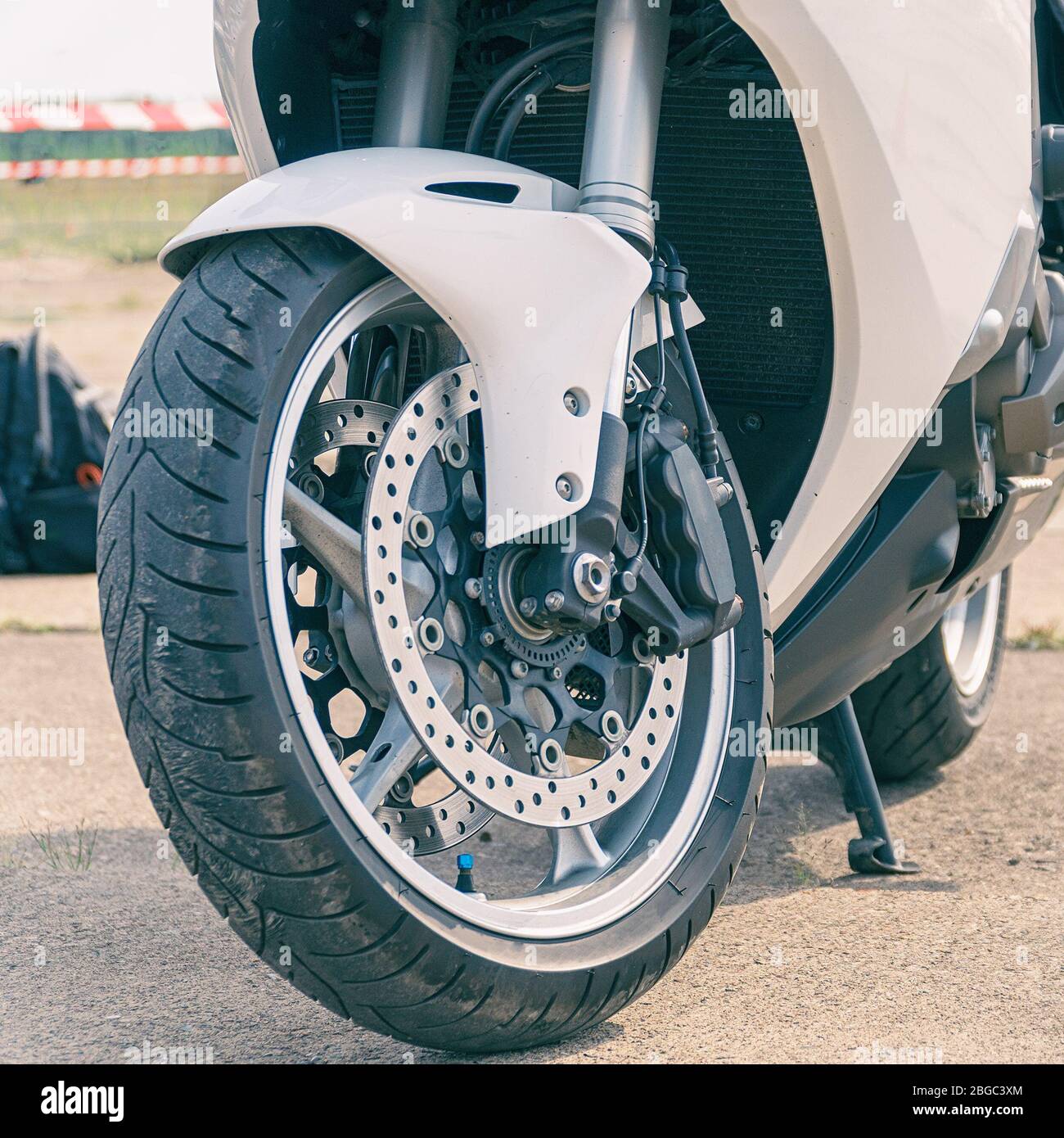 White road bike front wheel with front disc brake Stock Photo - Alamy