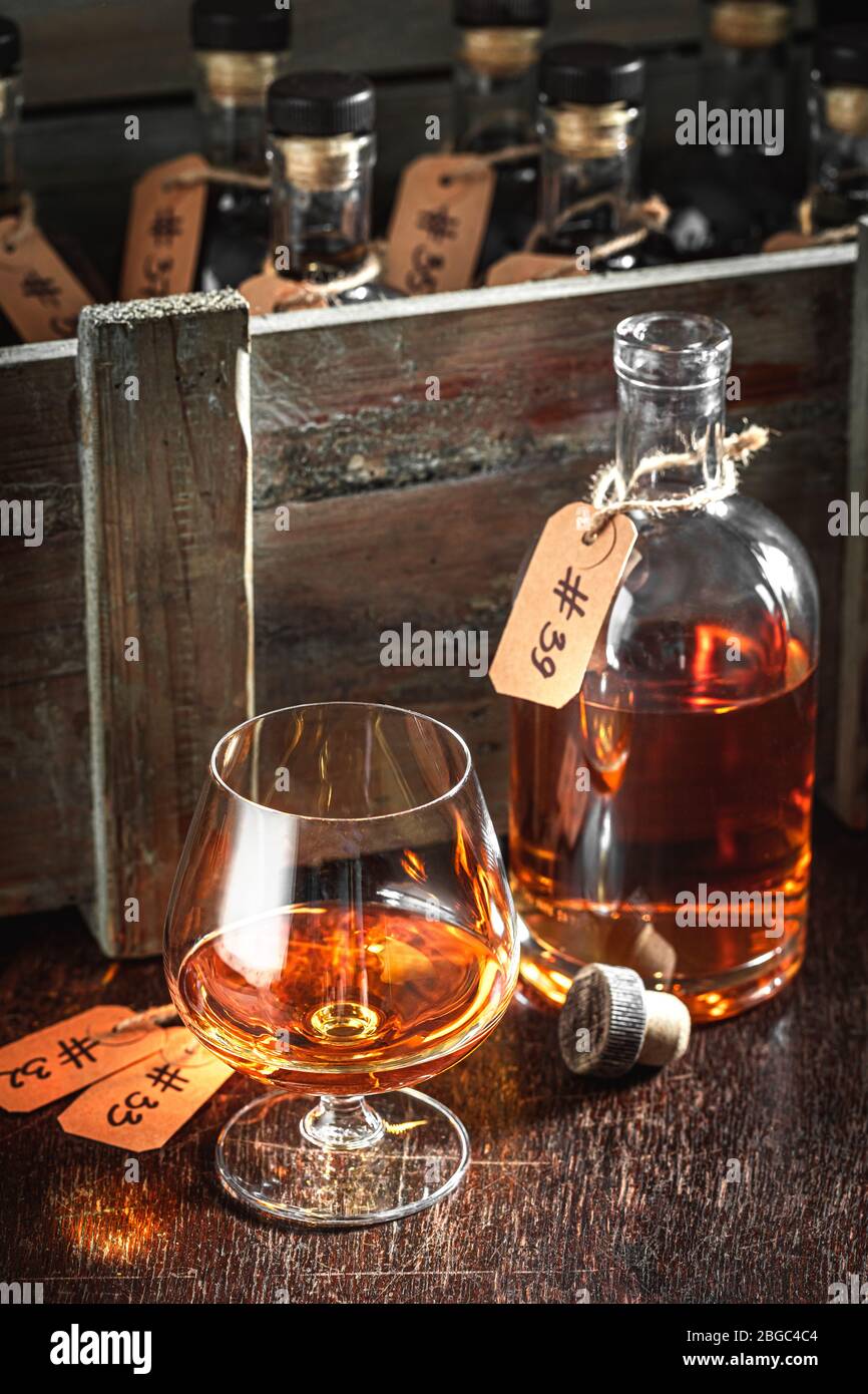 Hand crafted cognac in the old distillery warehouse Stock Photo - Alamy