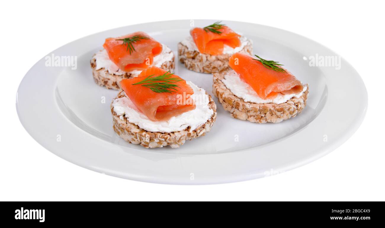 Delicious canapes on plate isolated on white Stock Photo - Alamy