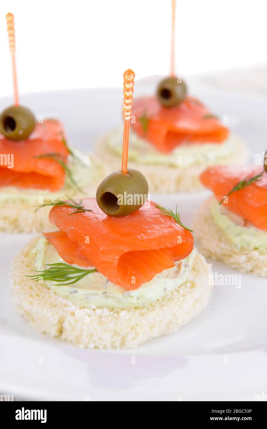 Delicious canapes on plate close-up Stock Photo - Alamy