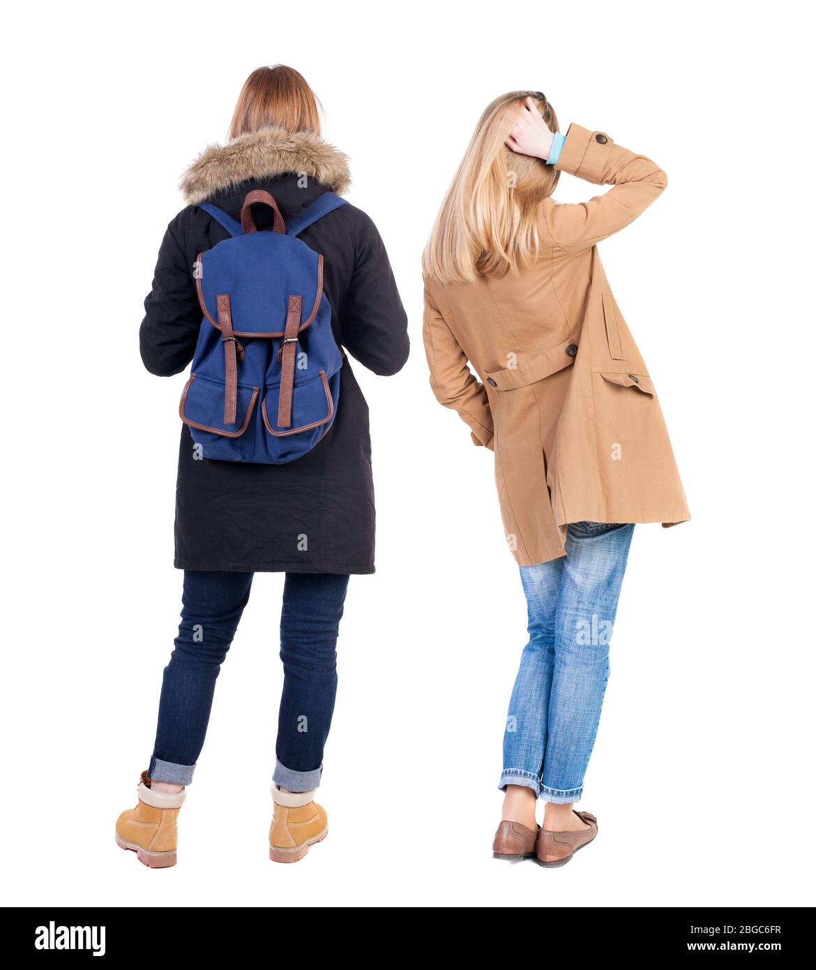 Back view of two young woman in winter jackets. Rear view people ...