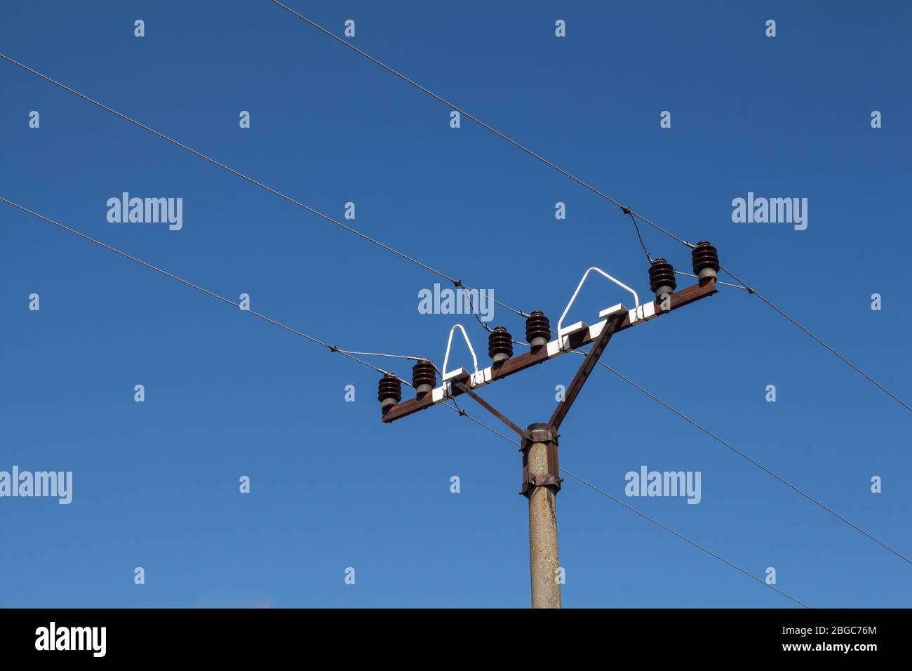 Detail of an electricity column, during a sunny day with a bright clear ...