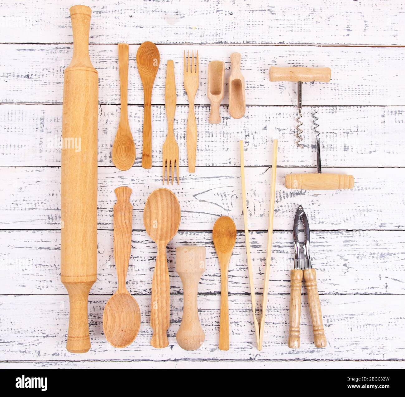 Wooden kitchen utensils on table close-up Stock Photo - Alamy