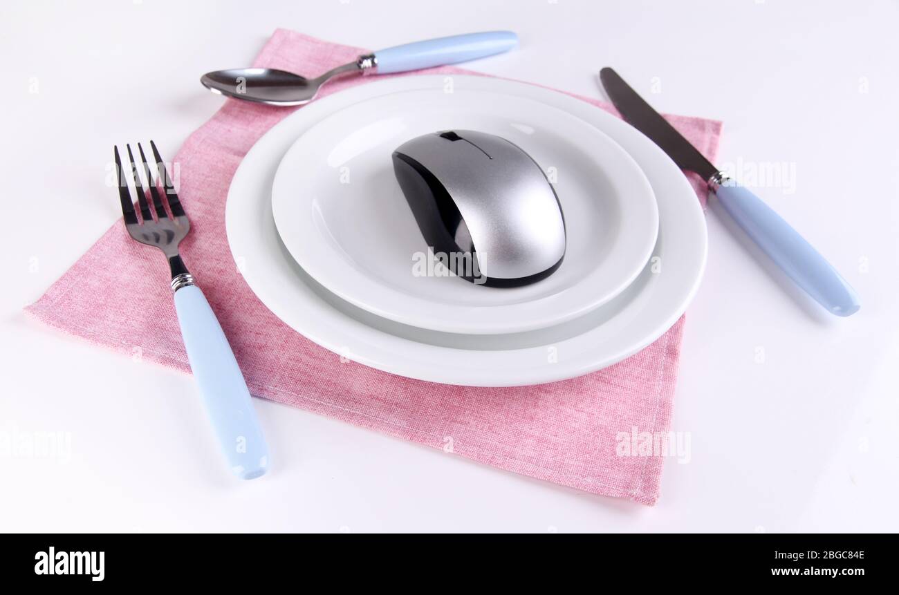Computer mouse on plate with fork and knife isolated on white Stock ...