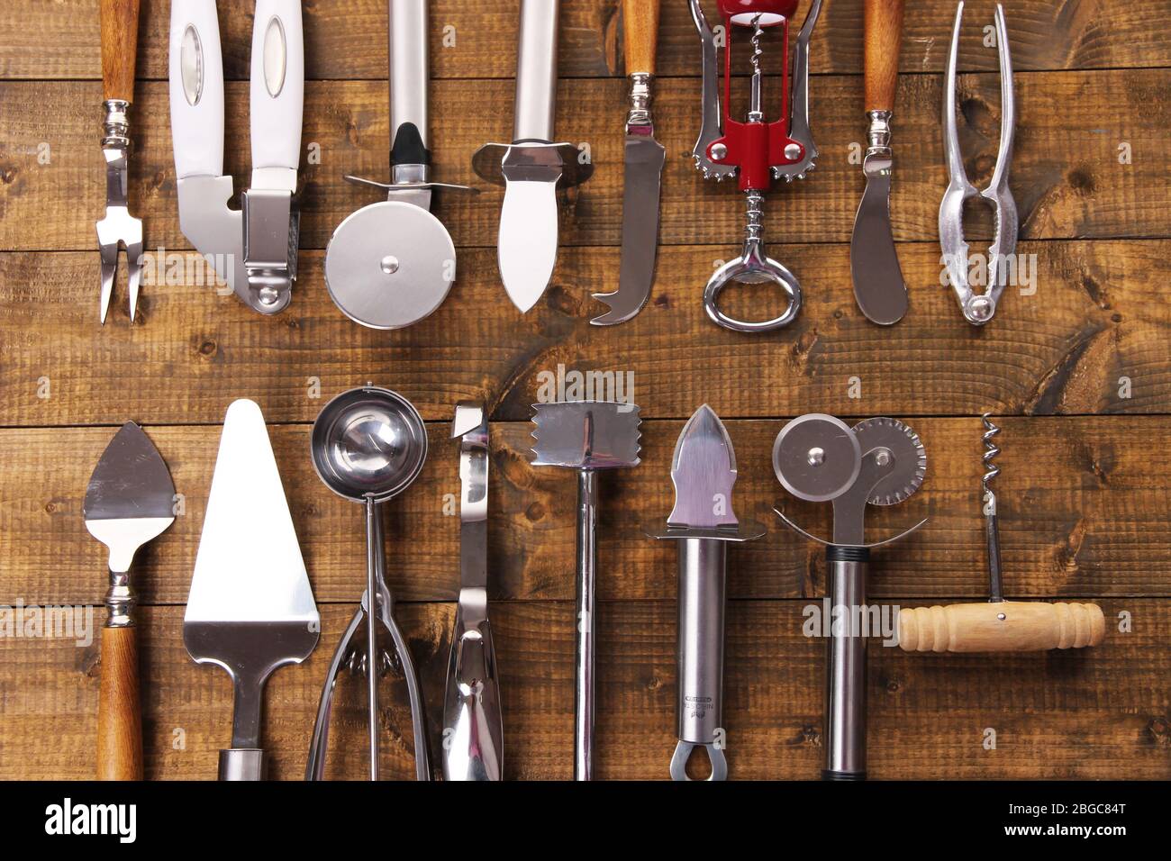 Metal kitchen utensils on table close-up Stock Photo - Alamy