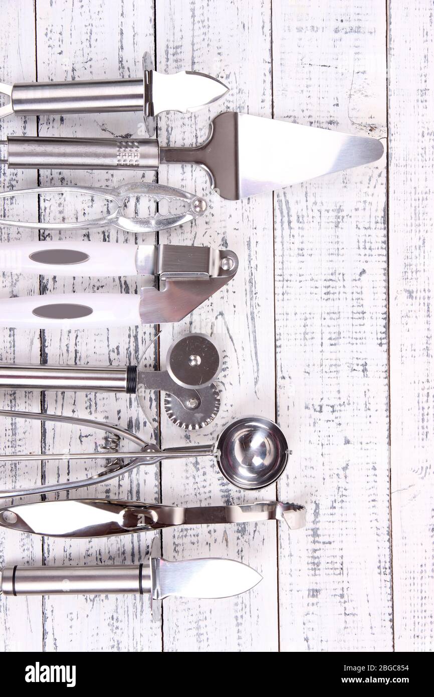Metal kitchen utensils on table close-up Stock Photo - Alamy