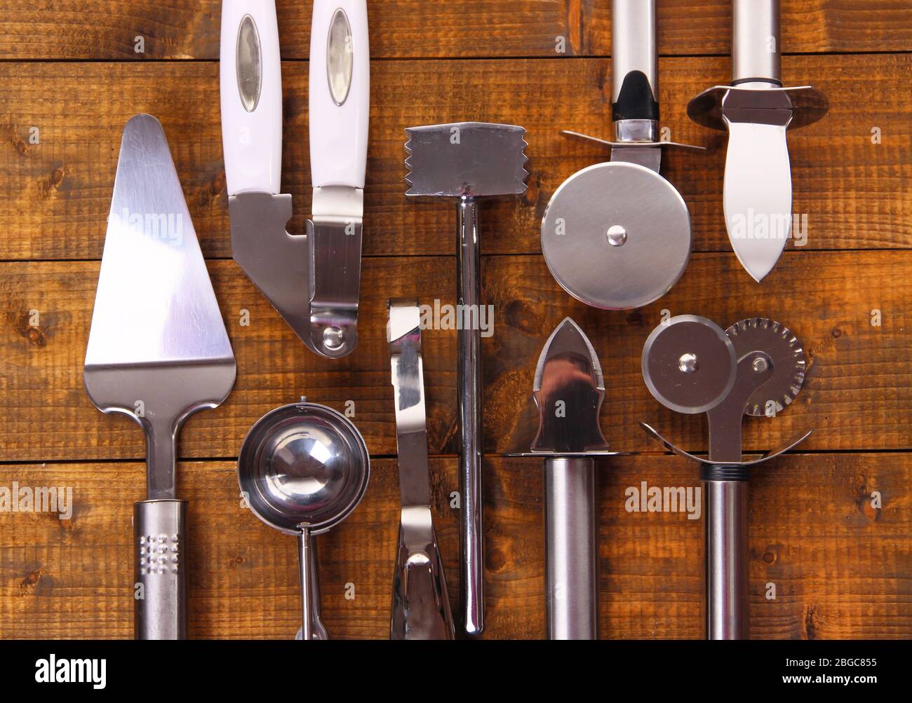 Metal kitchen utensils on table close-up Stock Photo - Alamy
