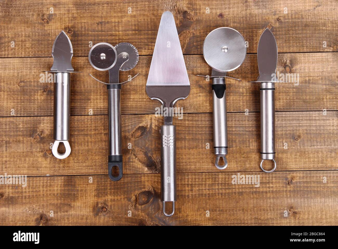 Metal kitchen utensils on table close-up Stock Photo - Alamy