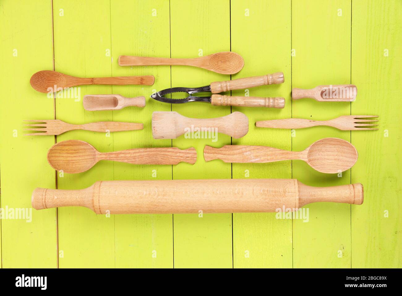 Wooden kitchen utensils on table close-up Stock Photo - Alamy