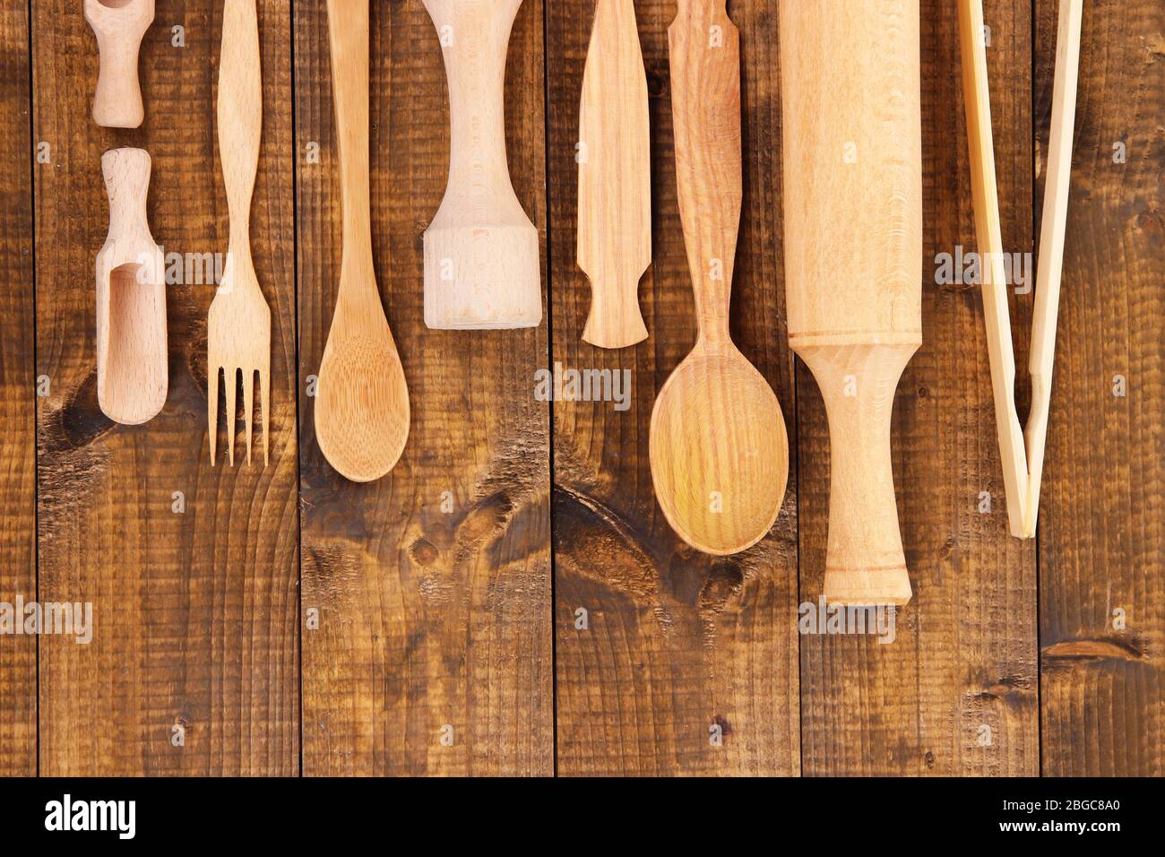 Wooden kitchen utensils on table close-up Stock Photo - Alamy