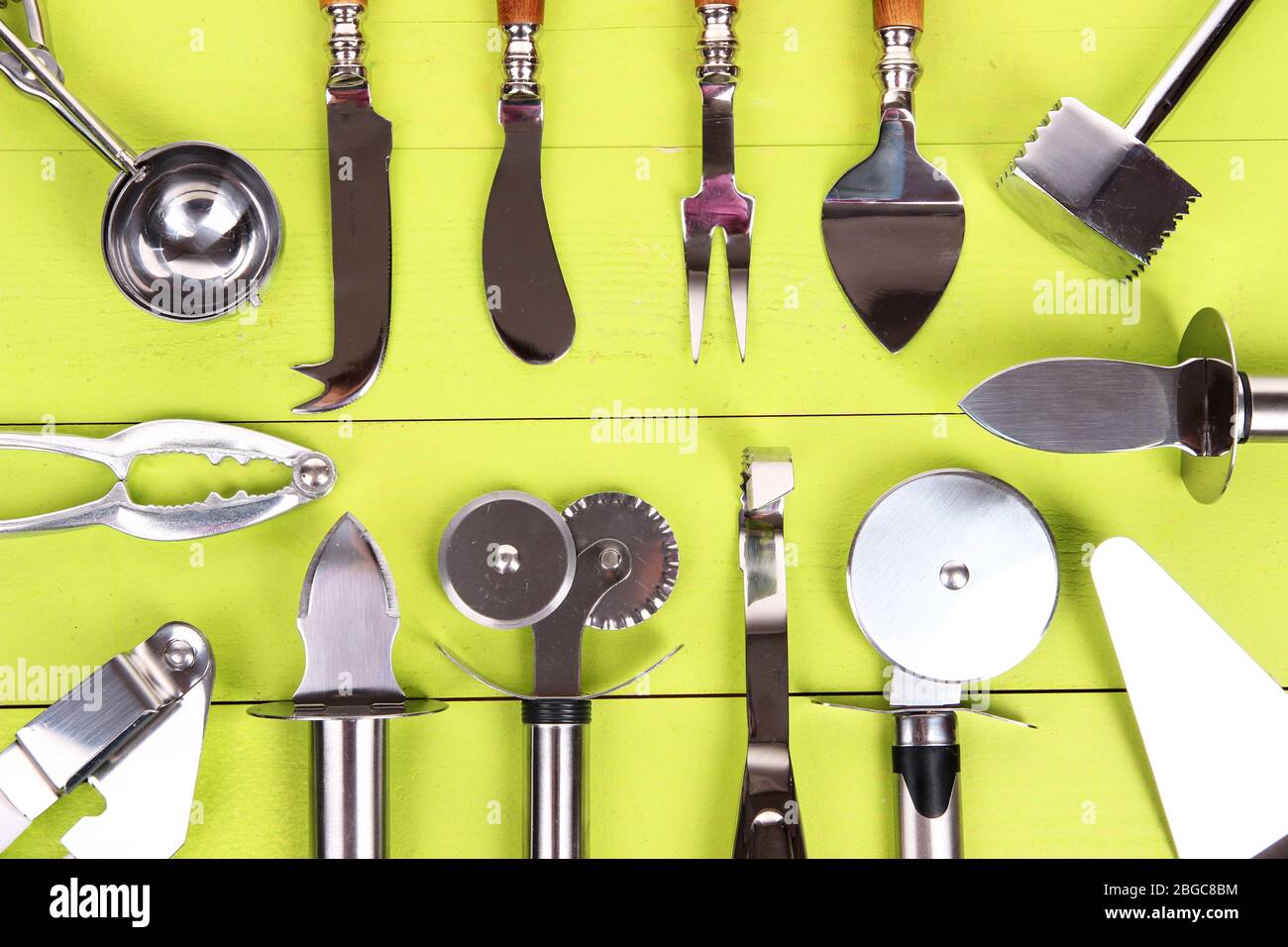 Metal kitchen utensils on table close-up Stock Photo - Alamy