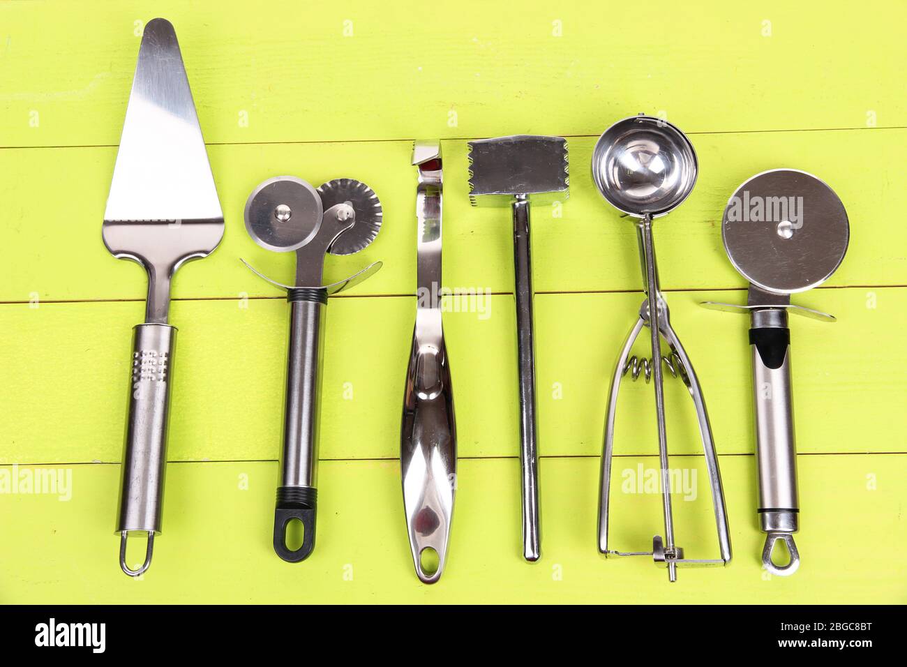 Metal kitchen utensils on table close-up Stock Photo - Alamy