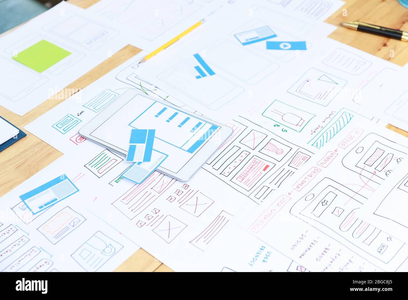 Graphic designers work together with UX UI designer planning ...