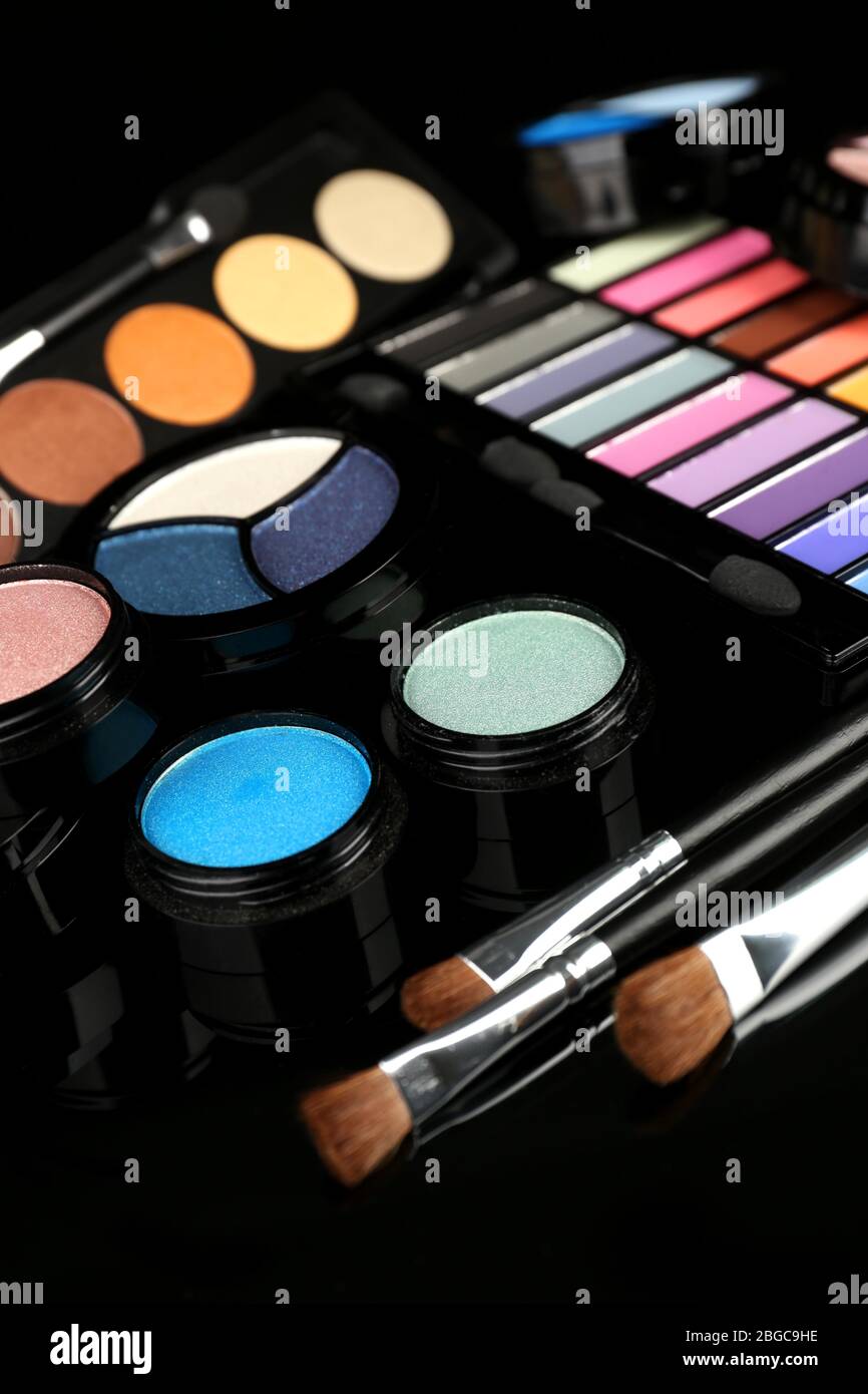 Bright eye shadows on black background Stock Photo - Alamy