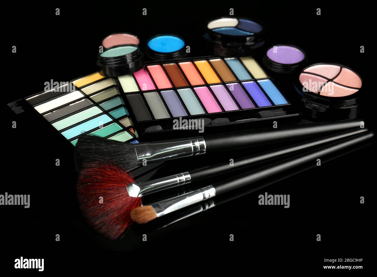Bright eye shadows on black background Stock Photo - Alamy