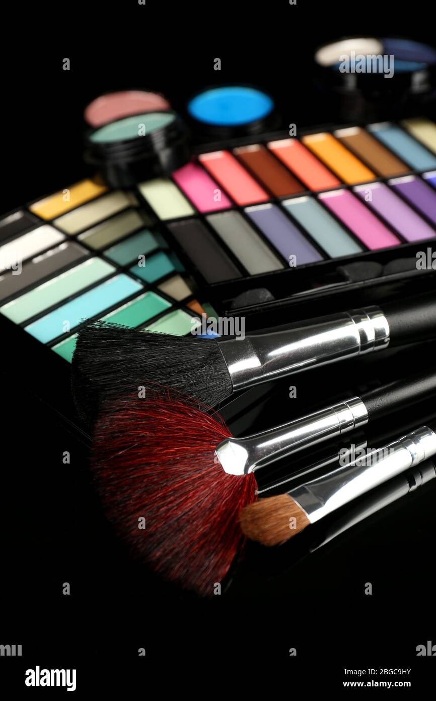 Bright eye shadows on black background Stock Photo - Alamy