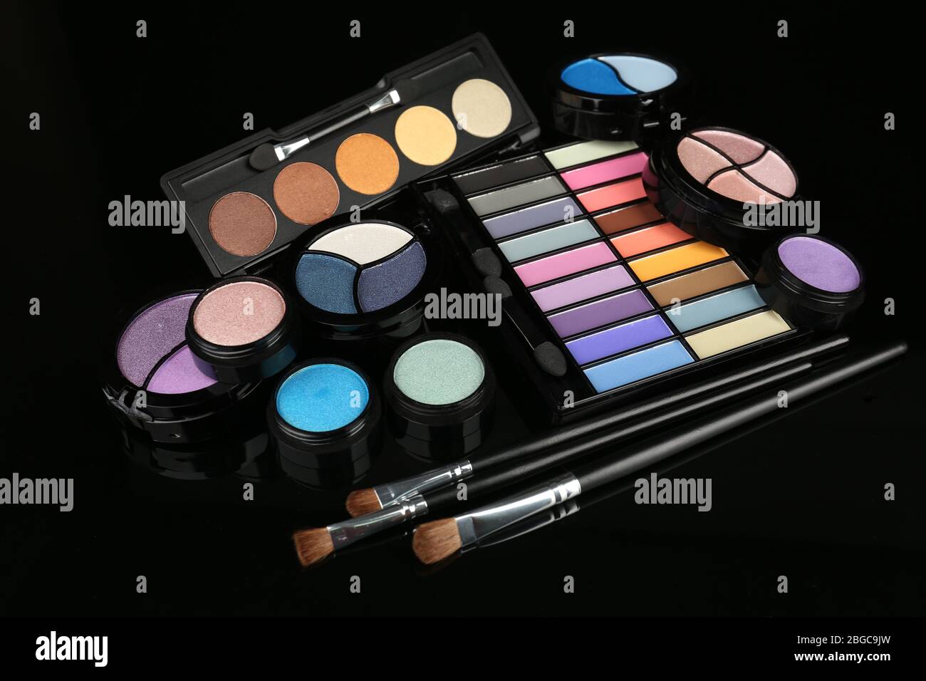 Bright eye shadows on black background Stock Photo - Alamy