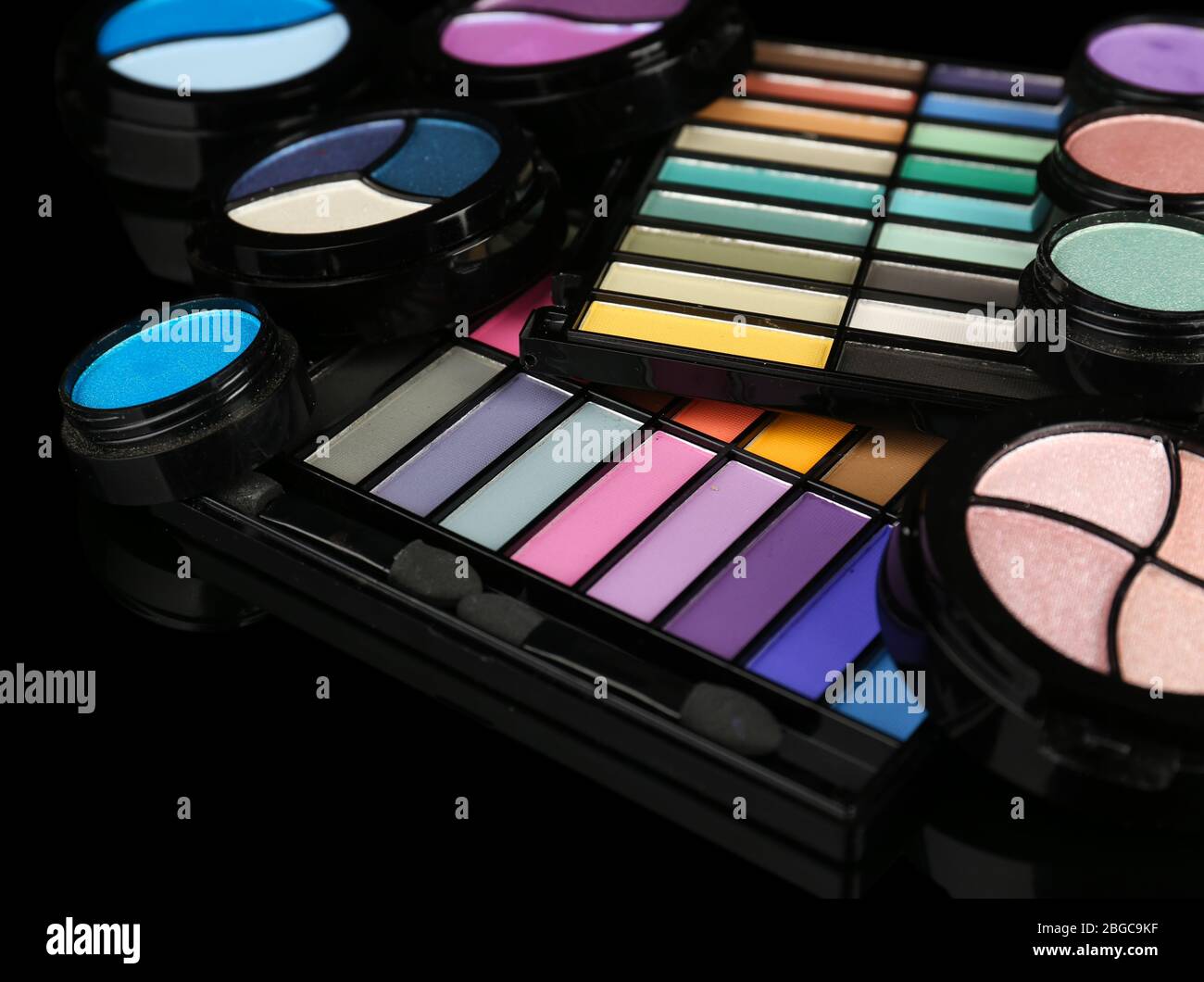 Bright eye shadows on black background Stock Photo - Alamy