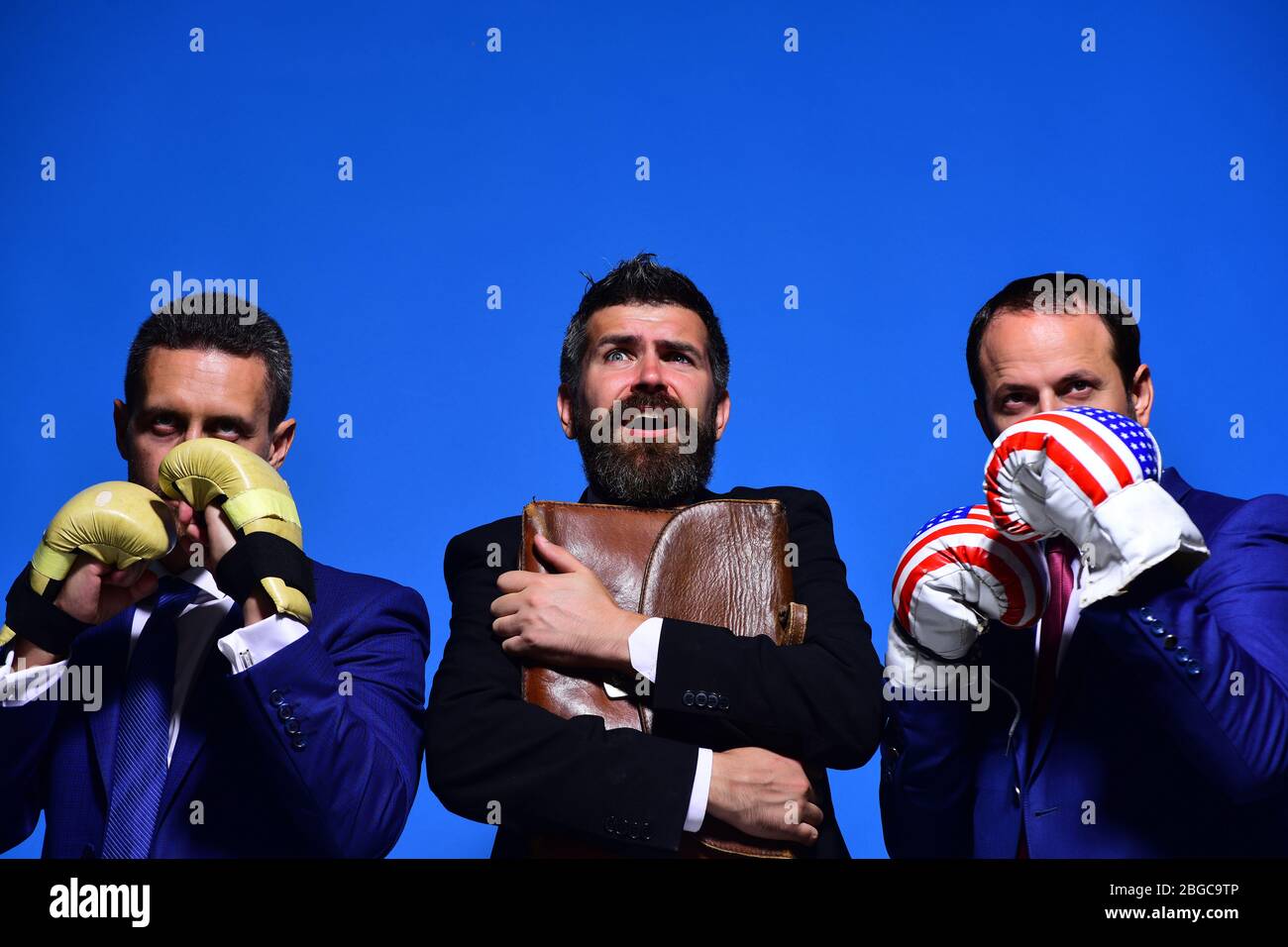 Company fights for business leadership. Businessmen and worker with ...