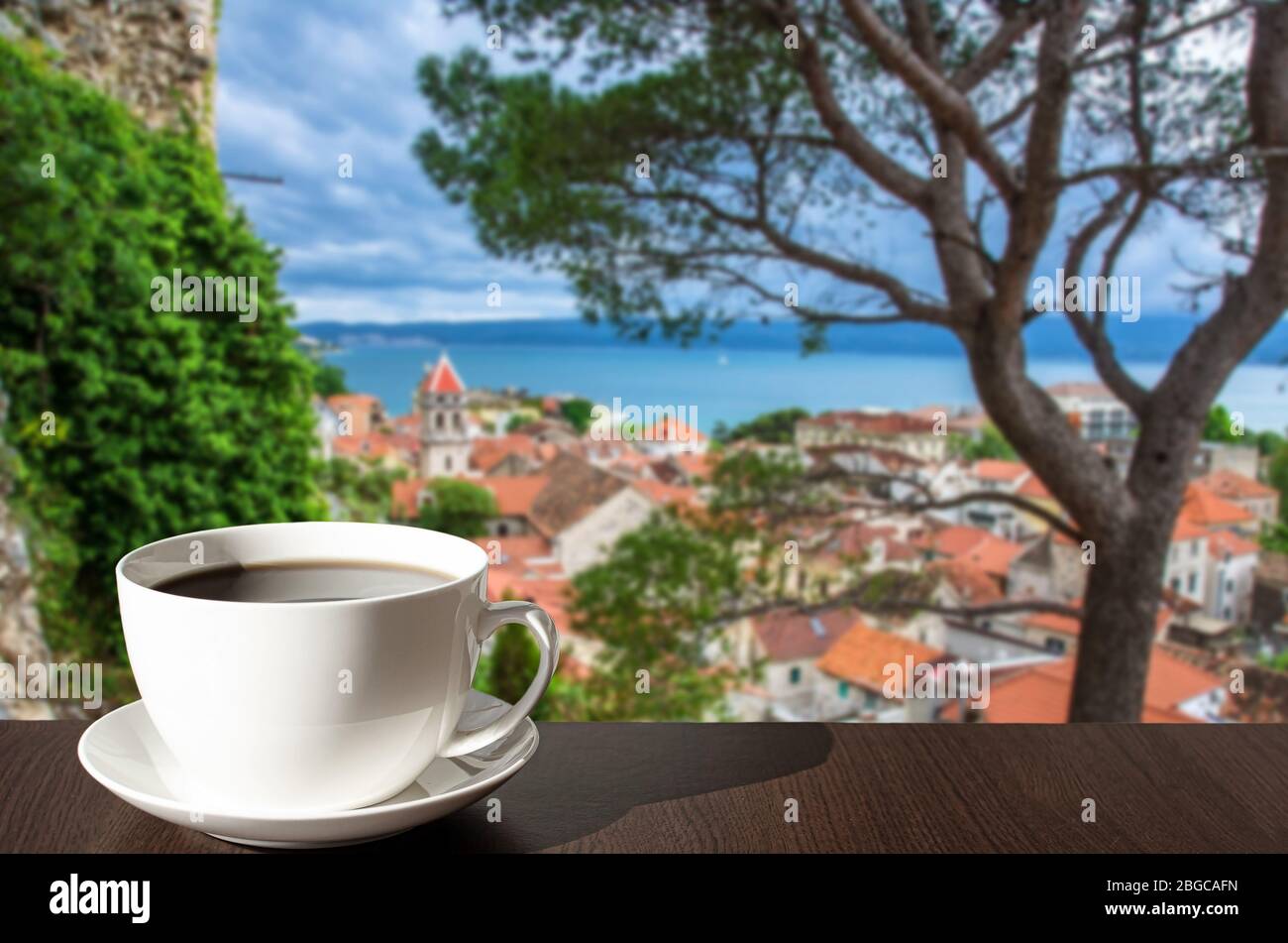 Cup of coffee and Mediterranean town landscape in Croatia Stock Photo ...