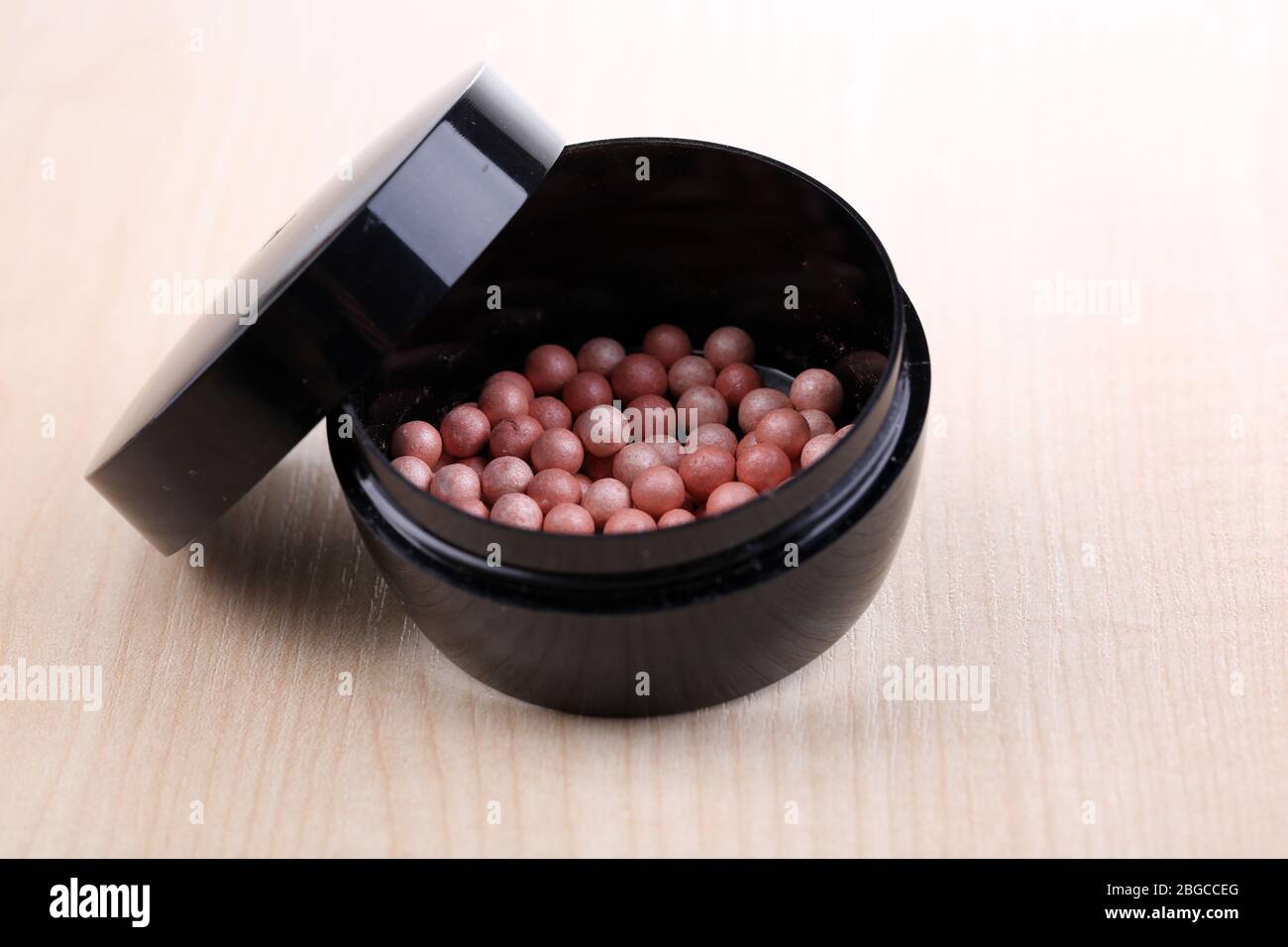 Powder balls on wooden background Stock Photo - Alamy